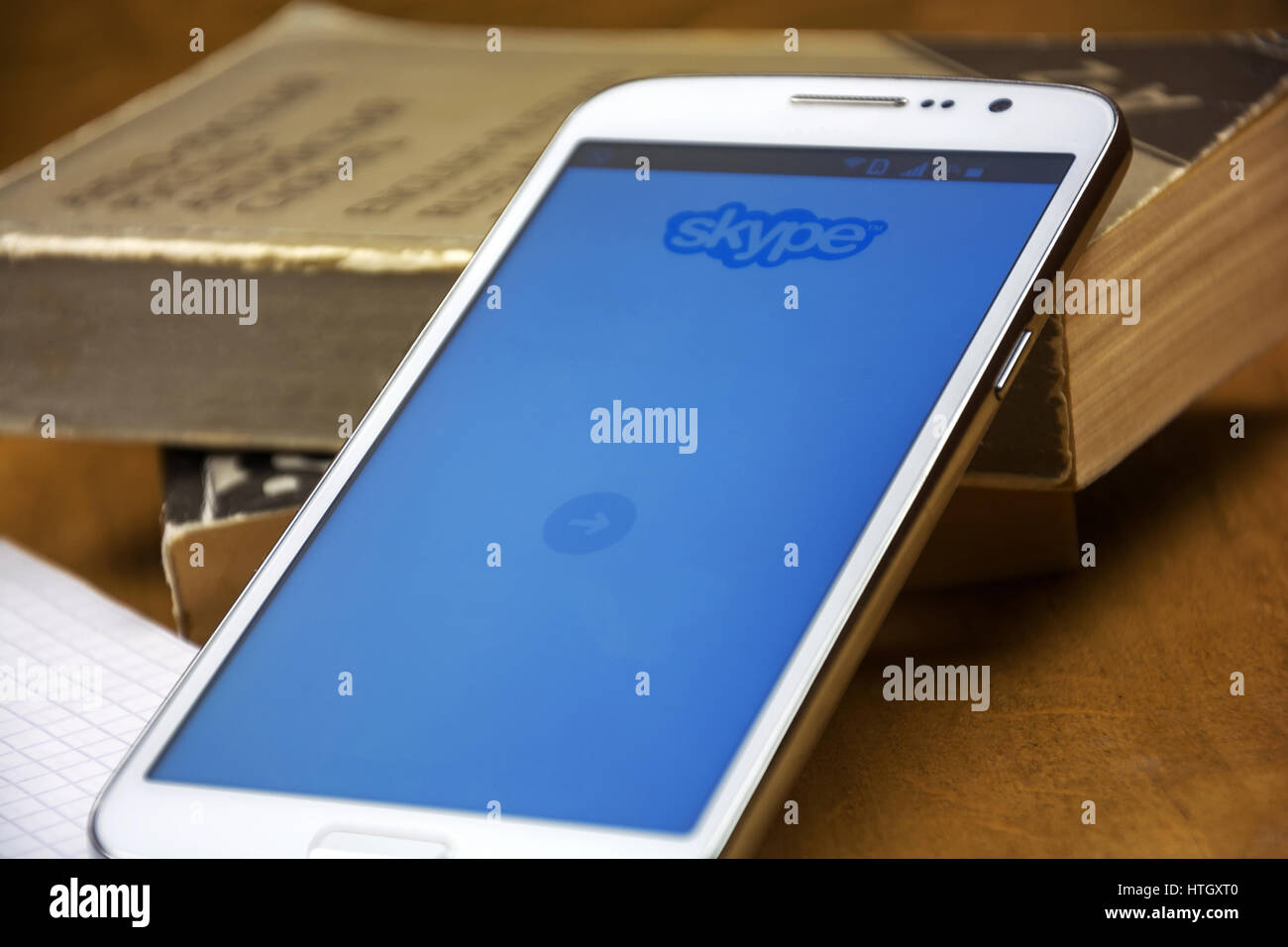 On the smartphone's screen, the start page of Skype is open Stock Photo ...