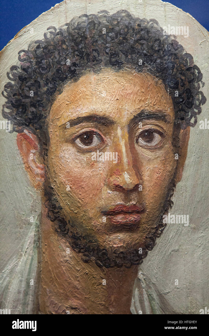 Fayum mummy portrait of a young man in Roman clothing from the Hawara ...