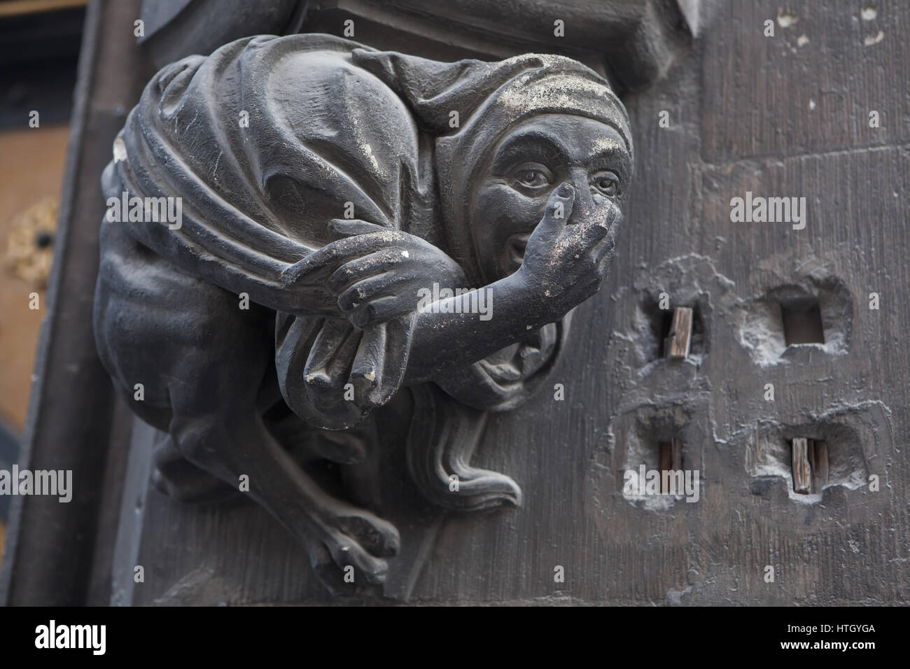 Gargoyle holding his nose depicted on the Neues Rathaus (New Town Hall ...