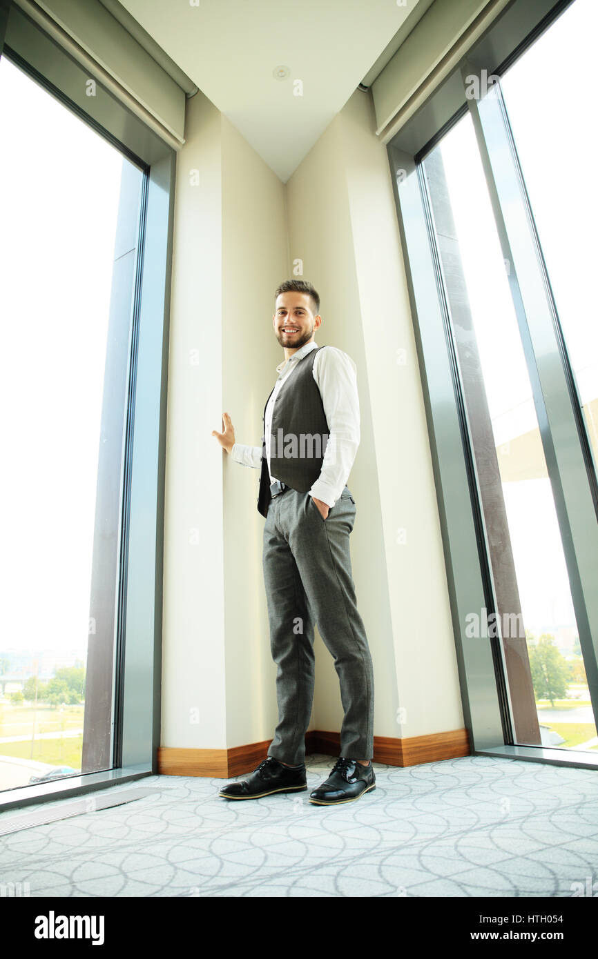 Portrait of a businessman looking at the window Stock Photo - Alamy
