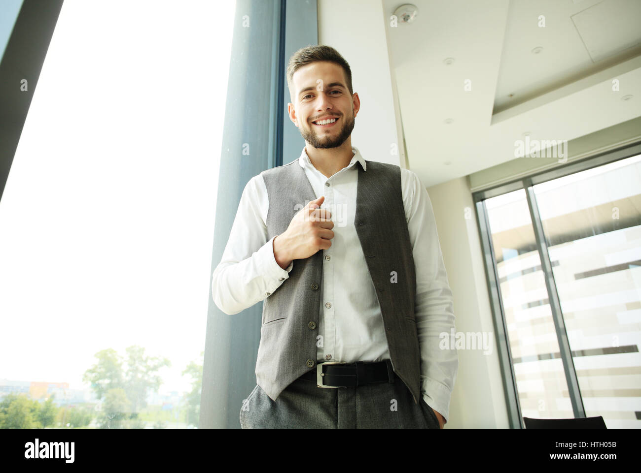 Portrait of a businessman looking at the window Stock Photo - Alamy
