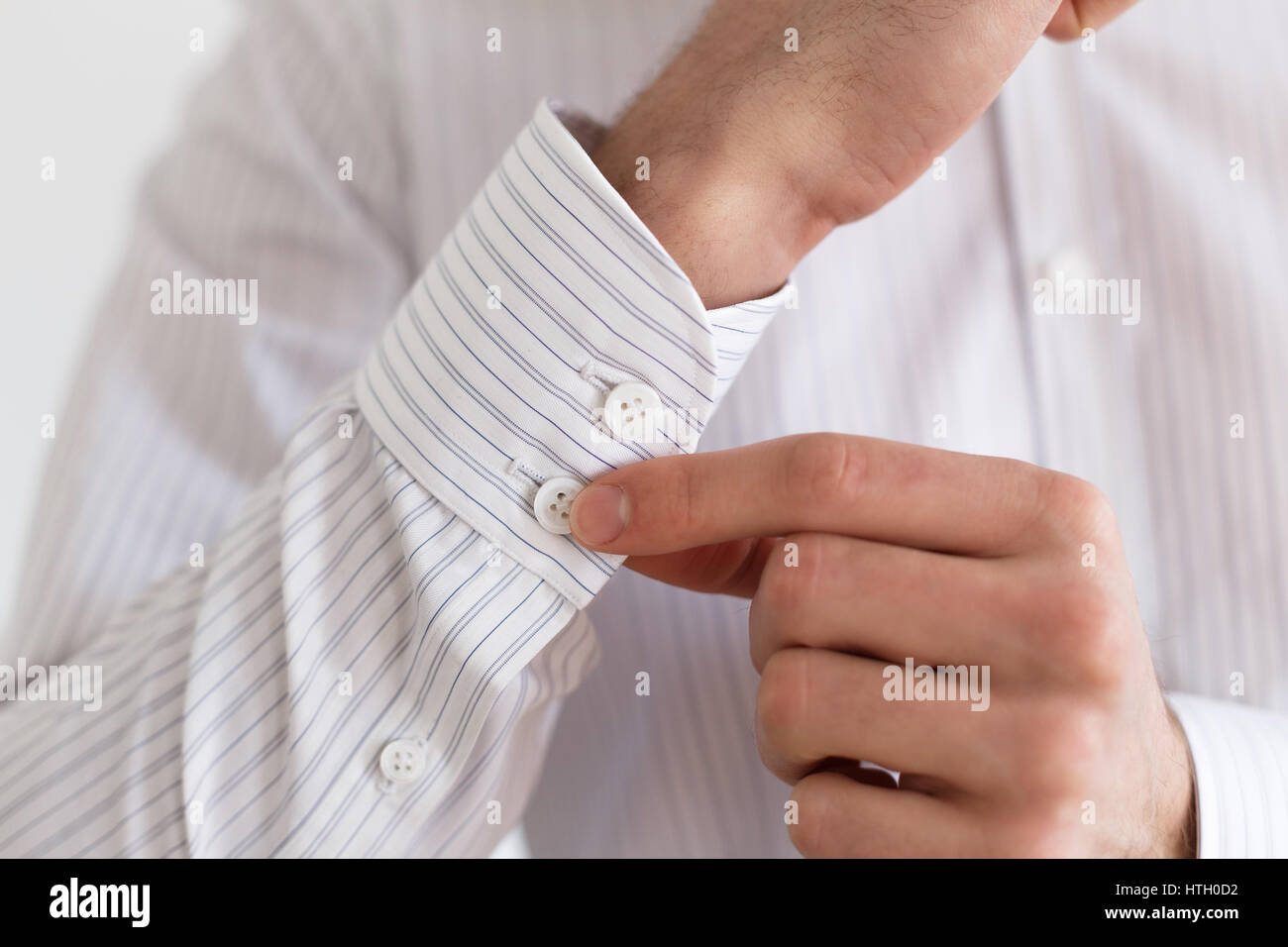 Sleeve of a white shirt. Buttons on Cuffs. close up view Stock Photo ...