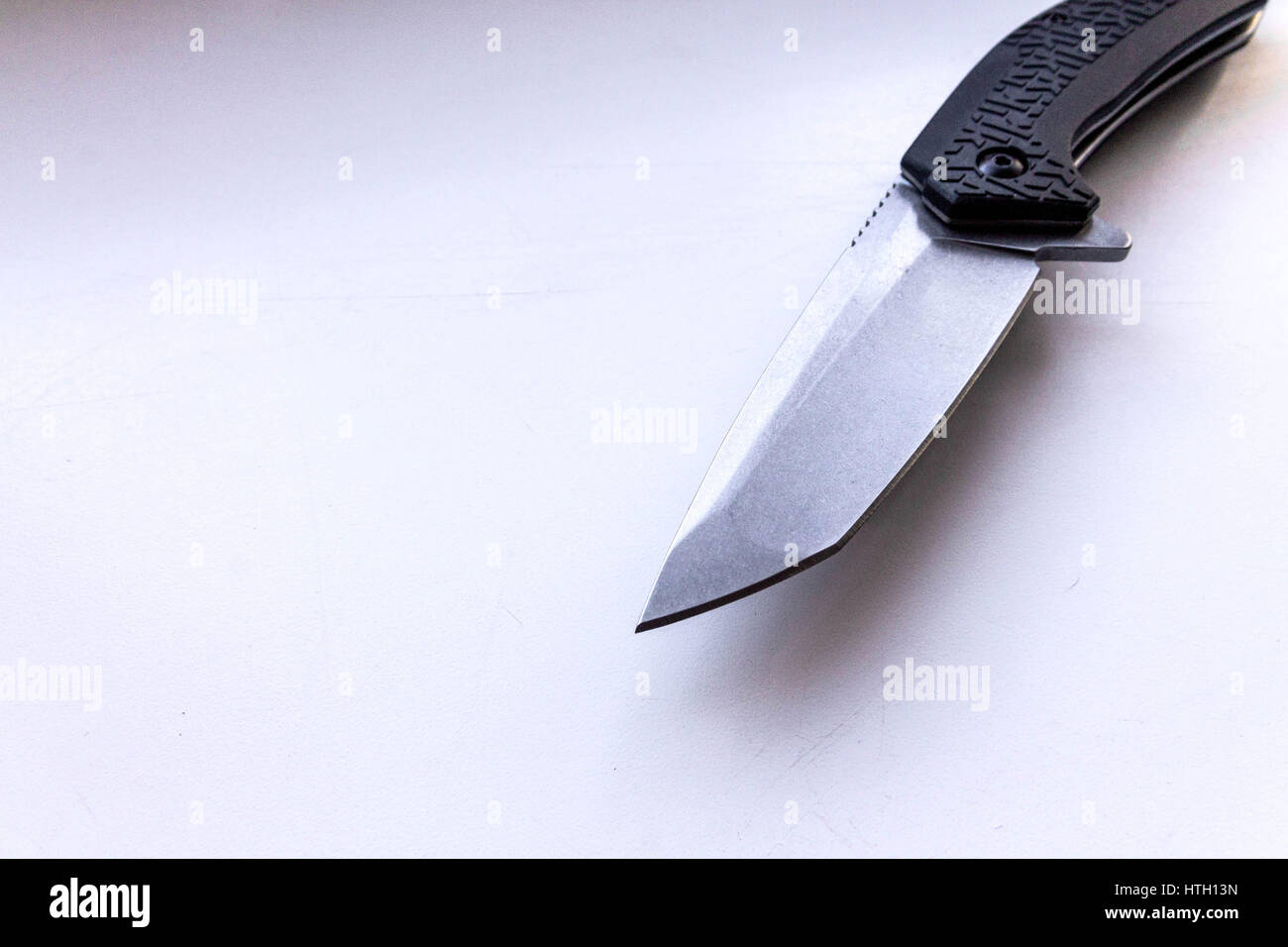 The blade of the knife. Gray background. Diagonal Stock Photo - Alamy