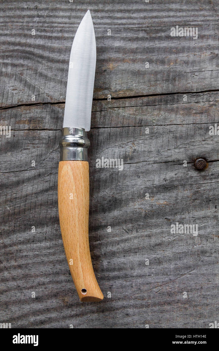 Knife for agriculture. Wood background. Knife with a unique mechanism ...