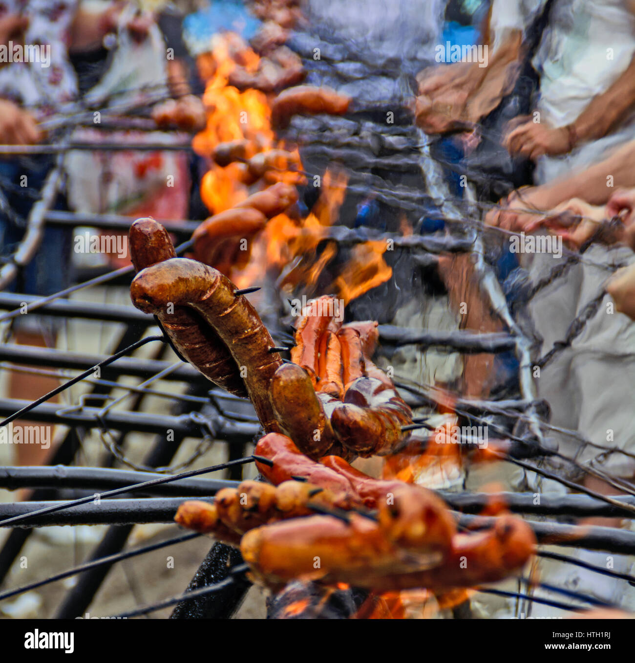 Traditionally street roast sausages on fire during the celebrations ...