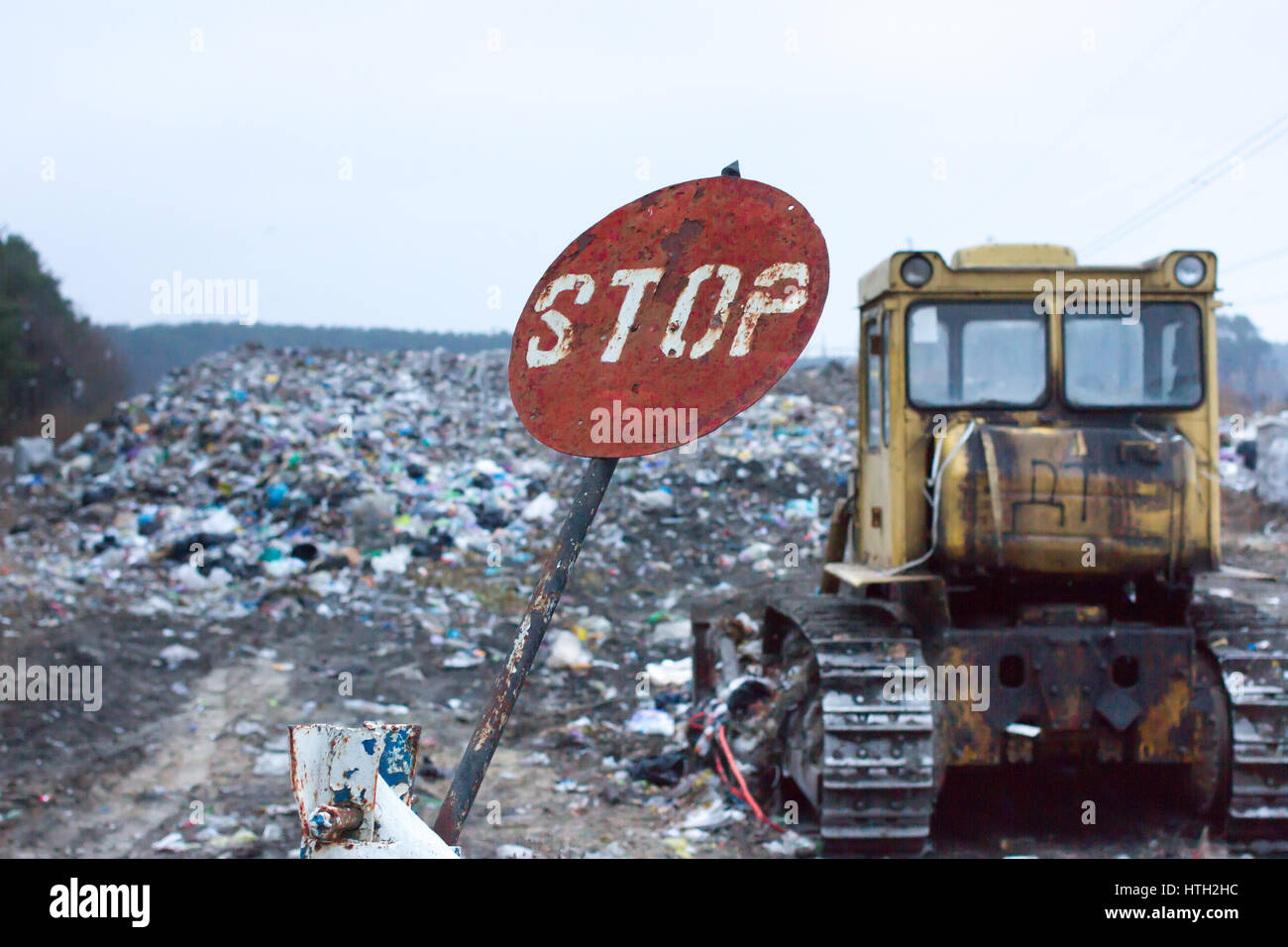 Red round stop sign, indicating that garbage at this dump has long ...