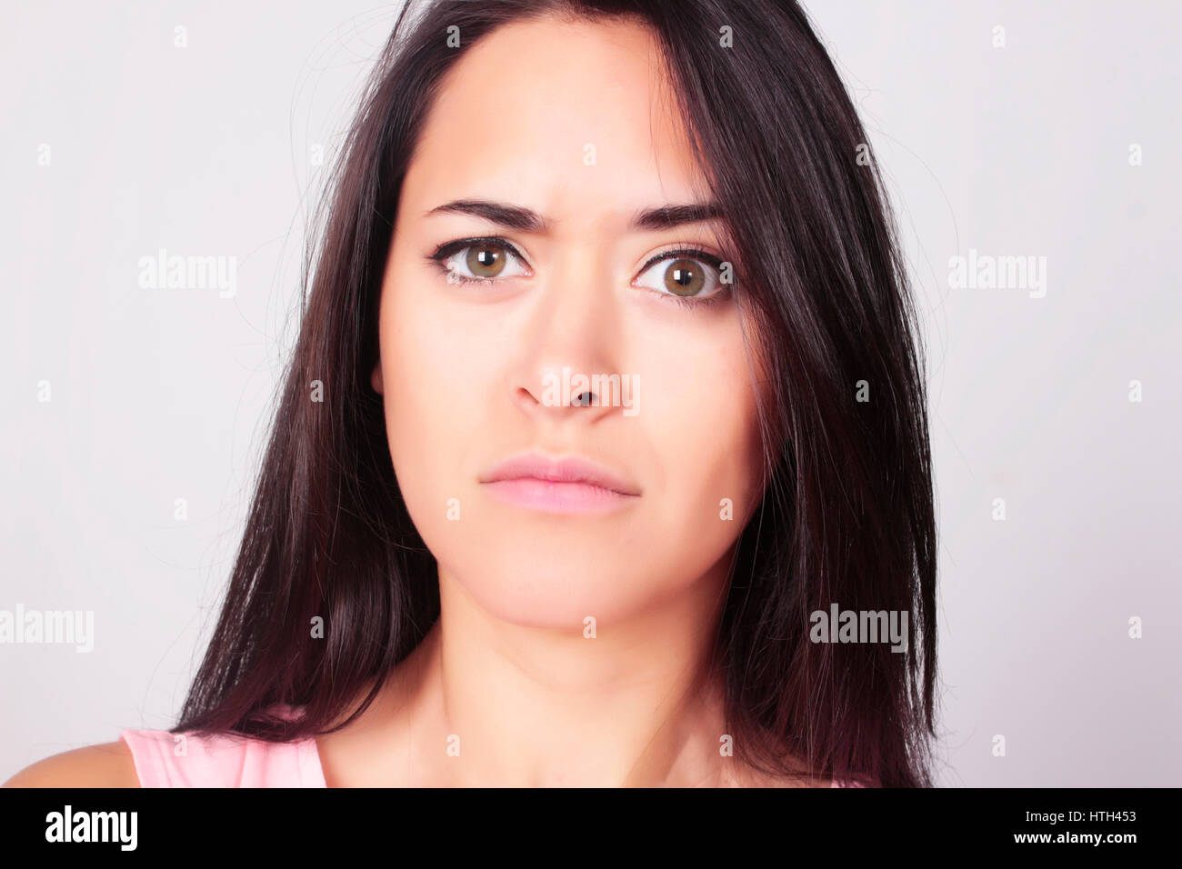Young woman with clueless and confused expression. Closeup shot of ...