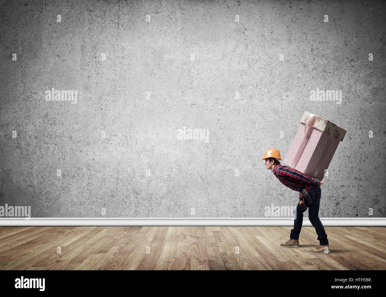 Man carrying on his back large box Stock Photo - Alamy