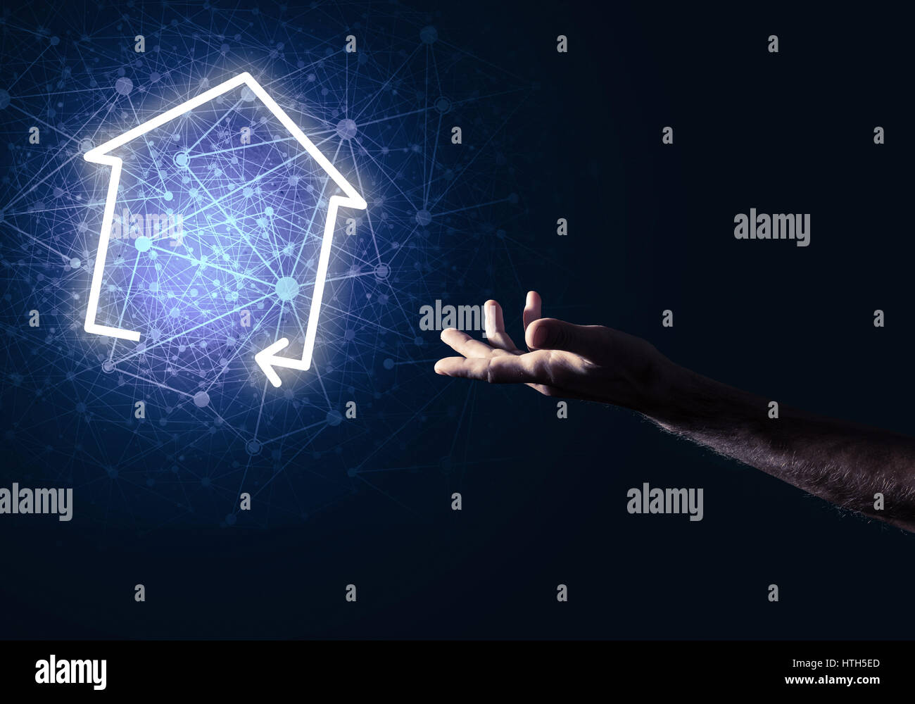 Male hand pointing to the glowing home icon or symbol Stock Photo - Alamy