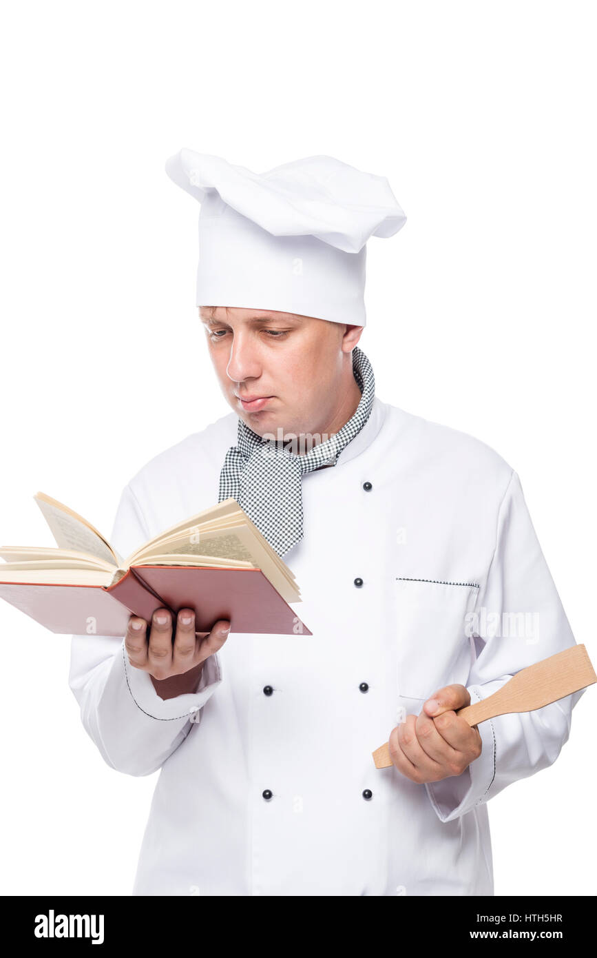 apprentice chef with a shovel in his hand reading a book on a white ...