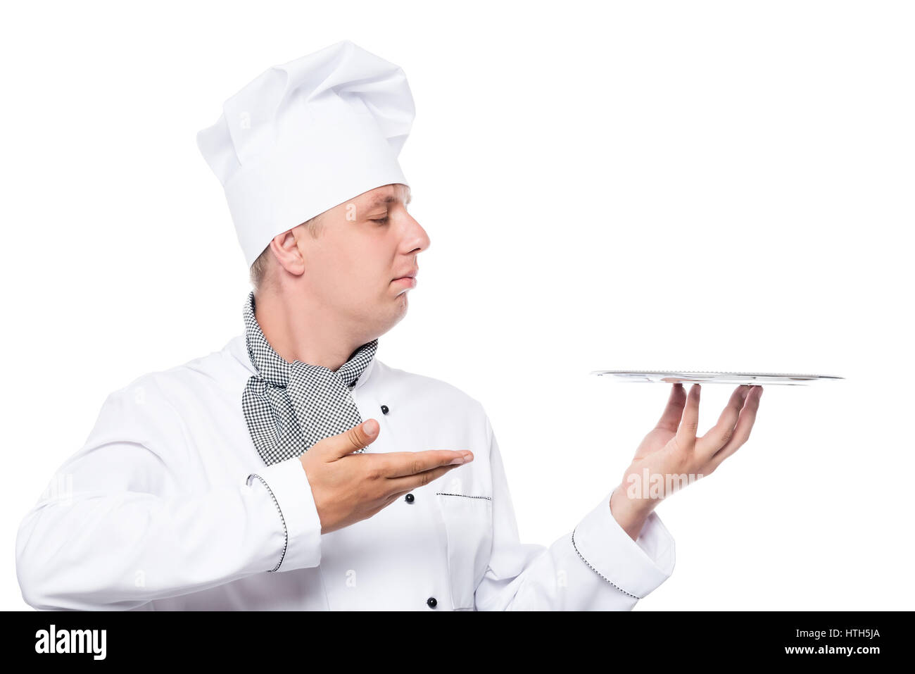 serious cook shows his hand on the empty tray on a white background ...