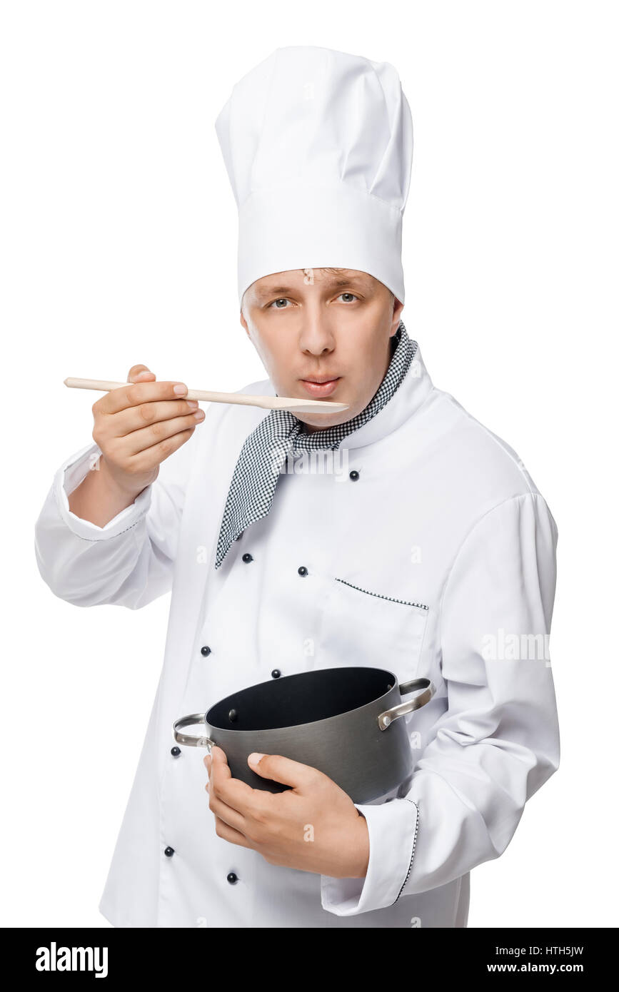 Chef tasting food in a pot on a white background Stock Photo - Alamy