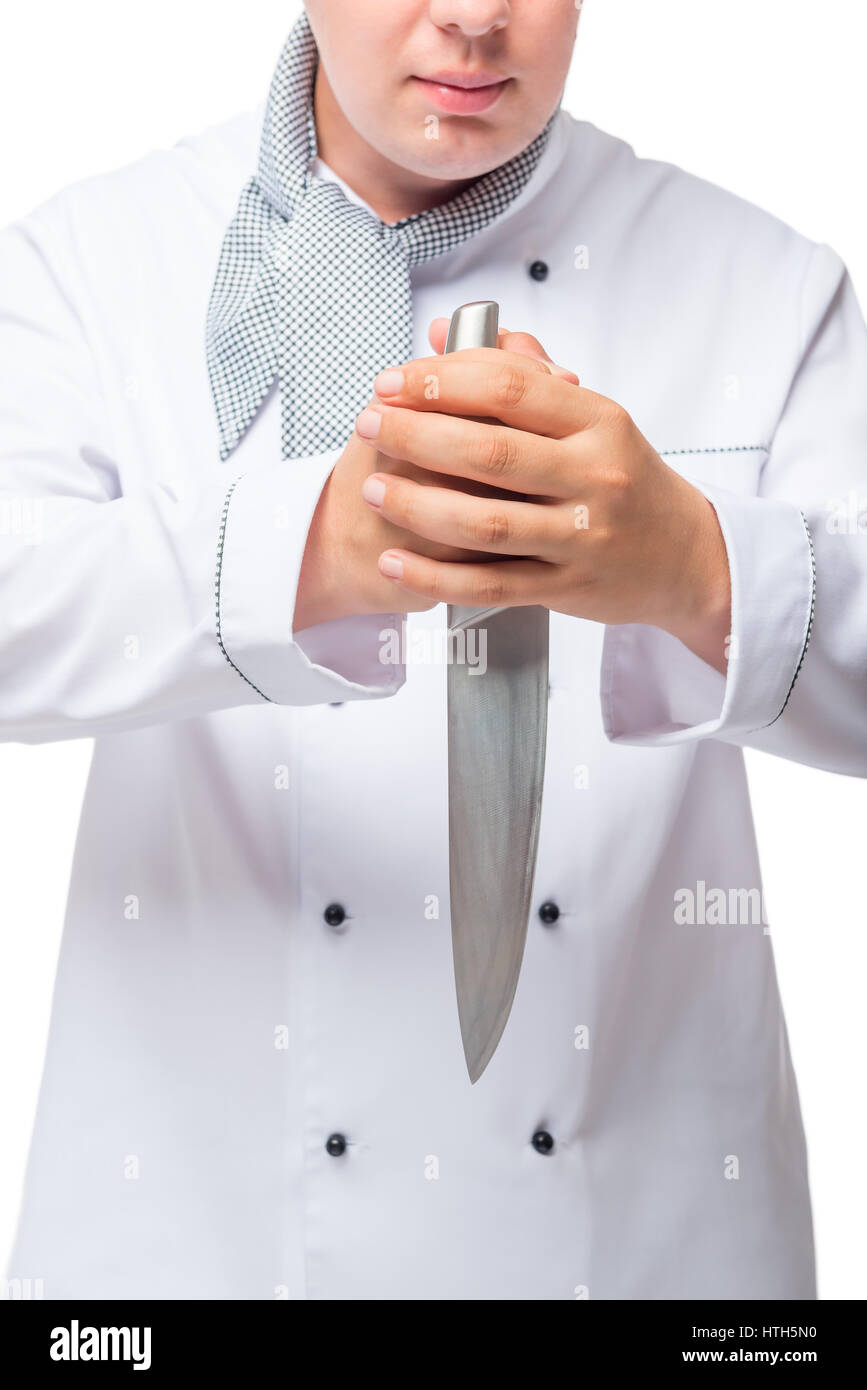 serious cook with a very sharp knife in his hands on a white background ...