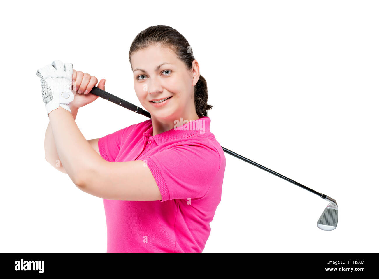 happy girl in a pink shirt on a white background with a golf club Stock ...
