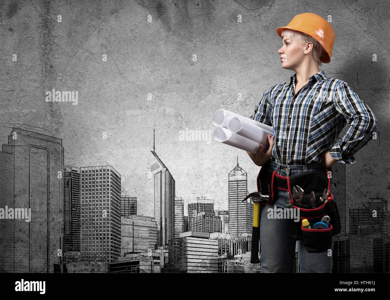 Engineer woman with blueprints and sketches of construction project on ...