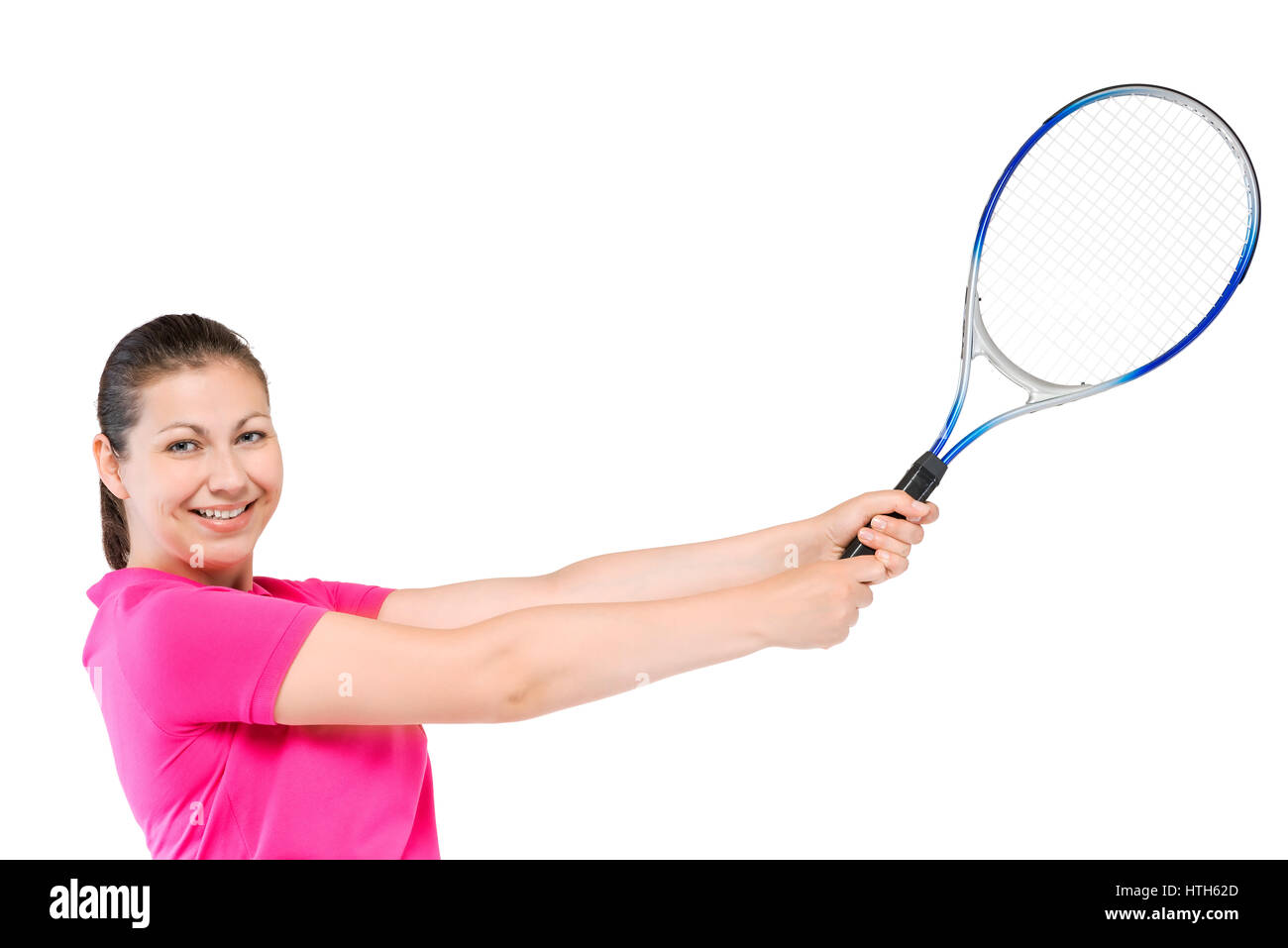horizontal portrait of the girl with a tennis racket in motion on a ...