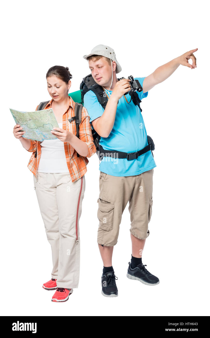 Vertical portrait of full-length two travelers with a map on a white ...