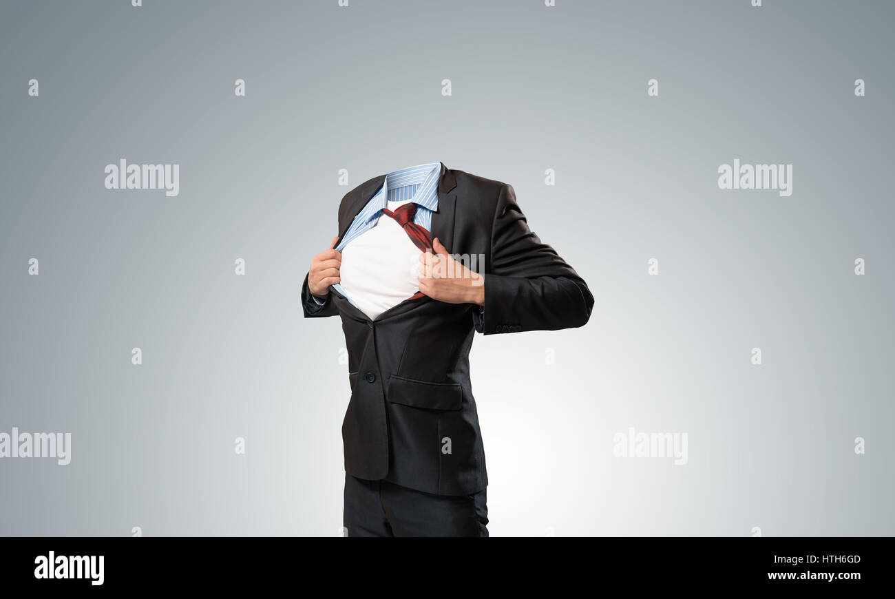 Headless businessman in black suit acting like super hero Stock Photo ...