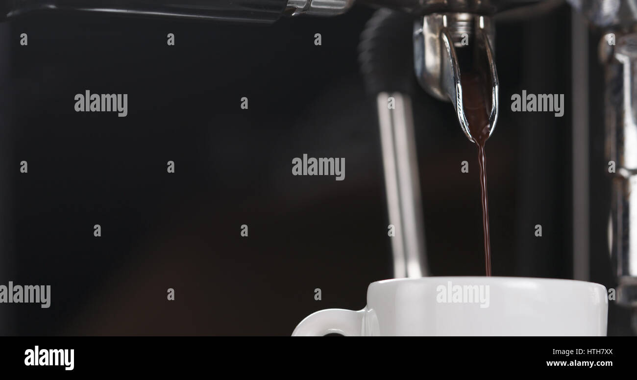 Close up of preparing espresso with professional coffee machine side ...