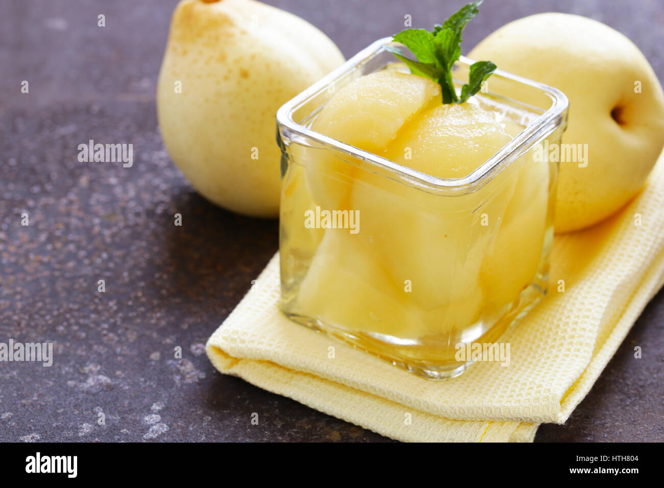 Canned fruit pears in a glass jar Stock Photo - Alamy