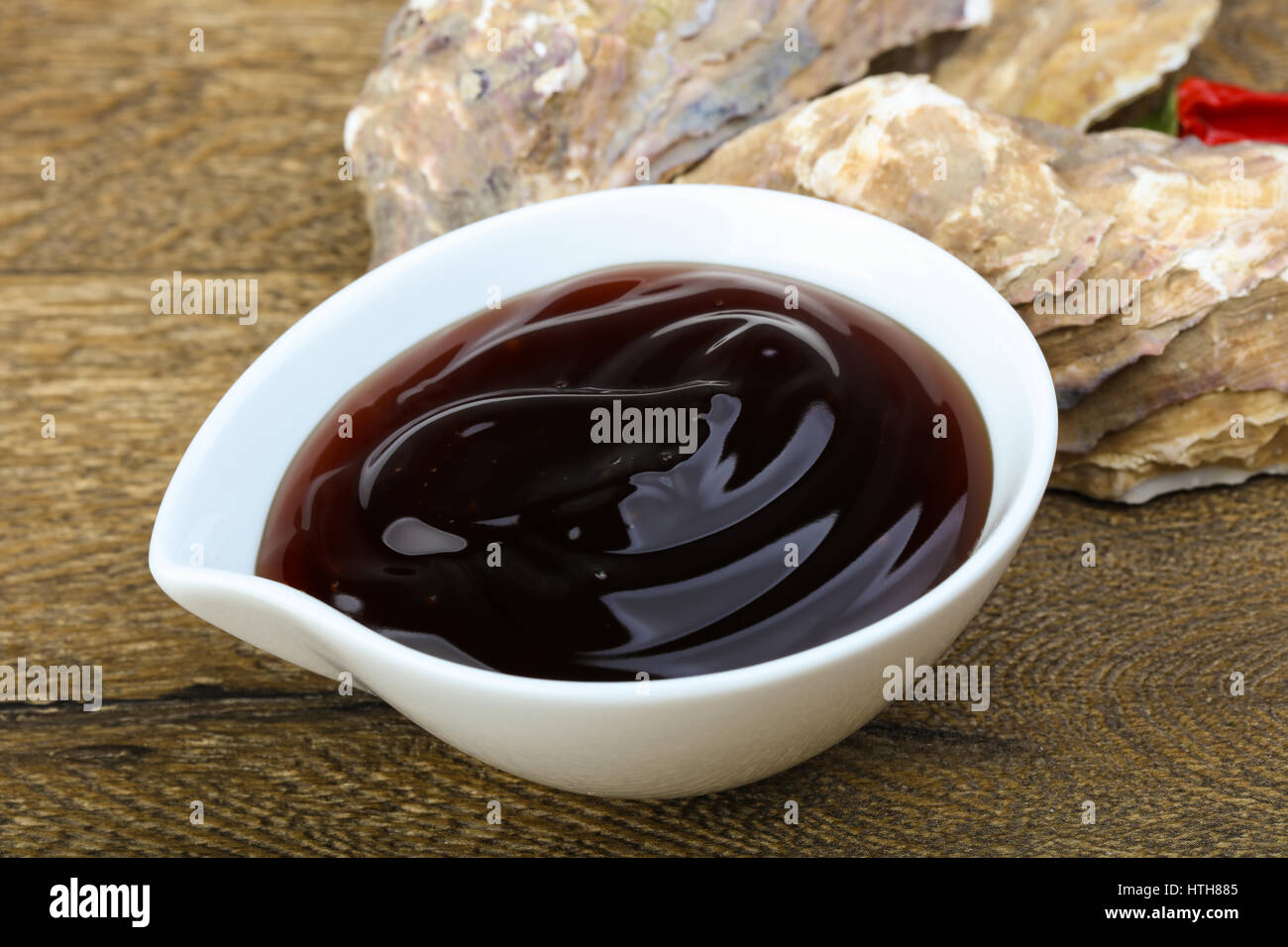 Oyster sauce in the bowl with shell Stock Photo - Alamy
