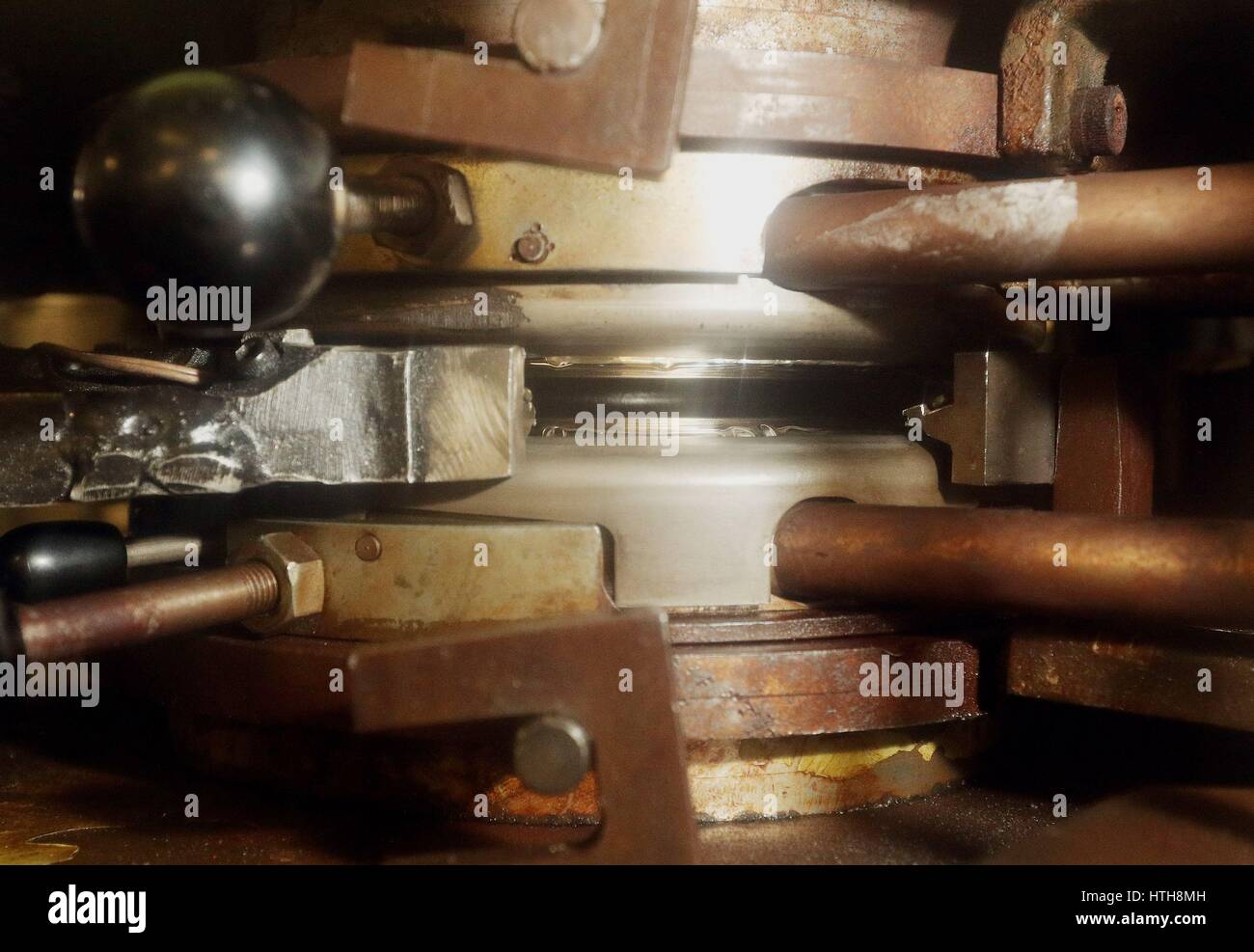 A hot vinyl puck is pressed into a seven inch record in an Alpha Toolex ...