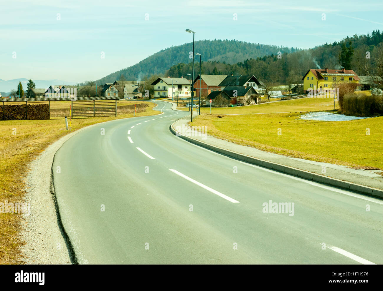 road through small European village Stock Photo - Alamy