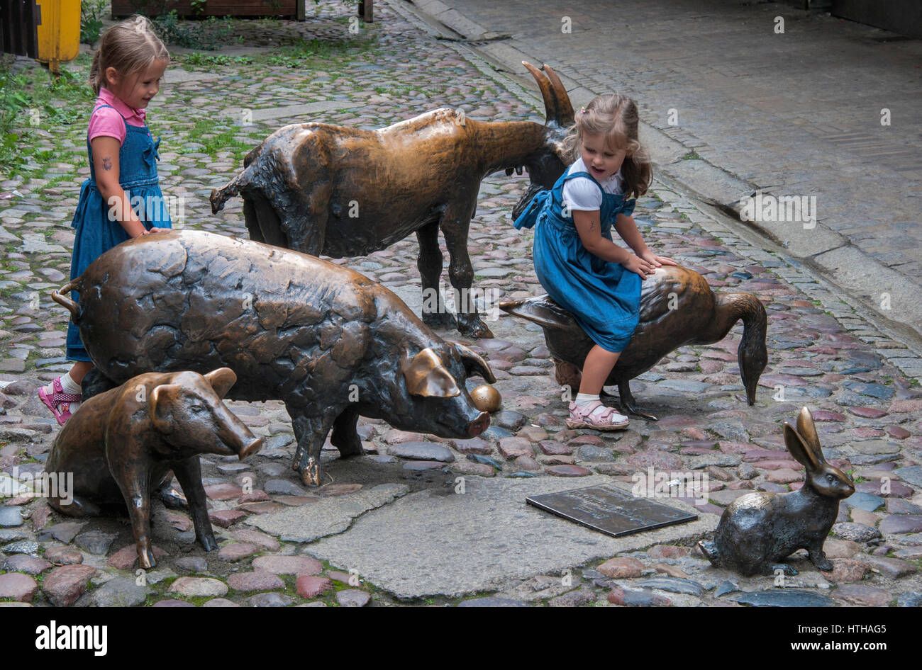 Two girls at sculptures "In Honor of Animals for Slaughter" at Jatki ...