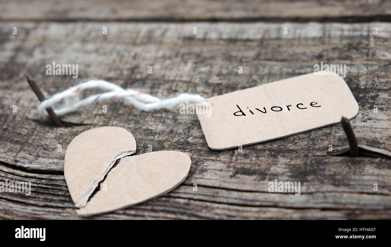 Divorce background with broken heart and message on wooden, unhappy ...