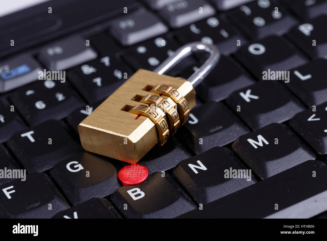 golden lock on black keyboard - computer security concept, internet ...