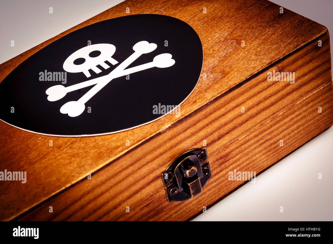 old wooden box with pirate symbol on white - skull and bones on black ...