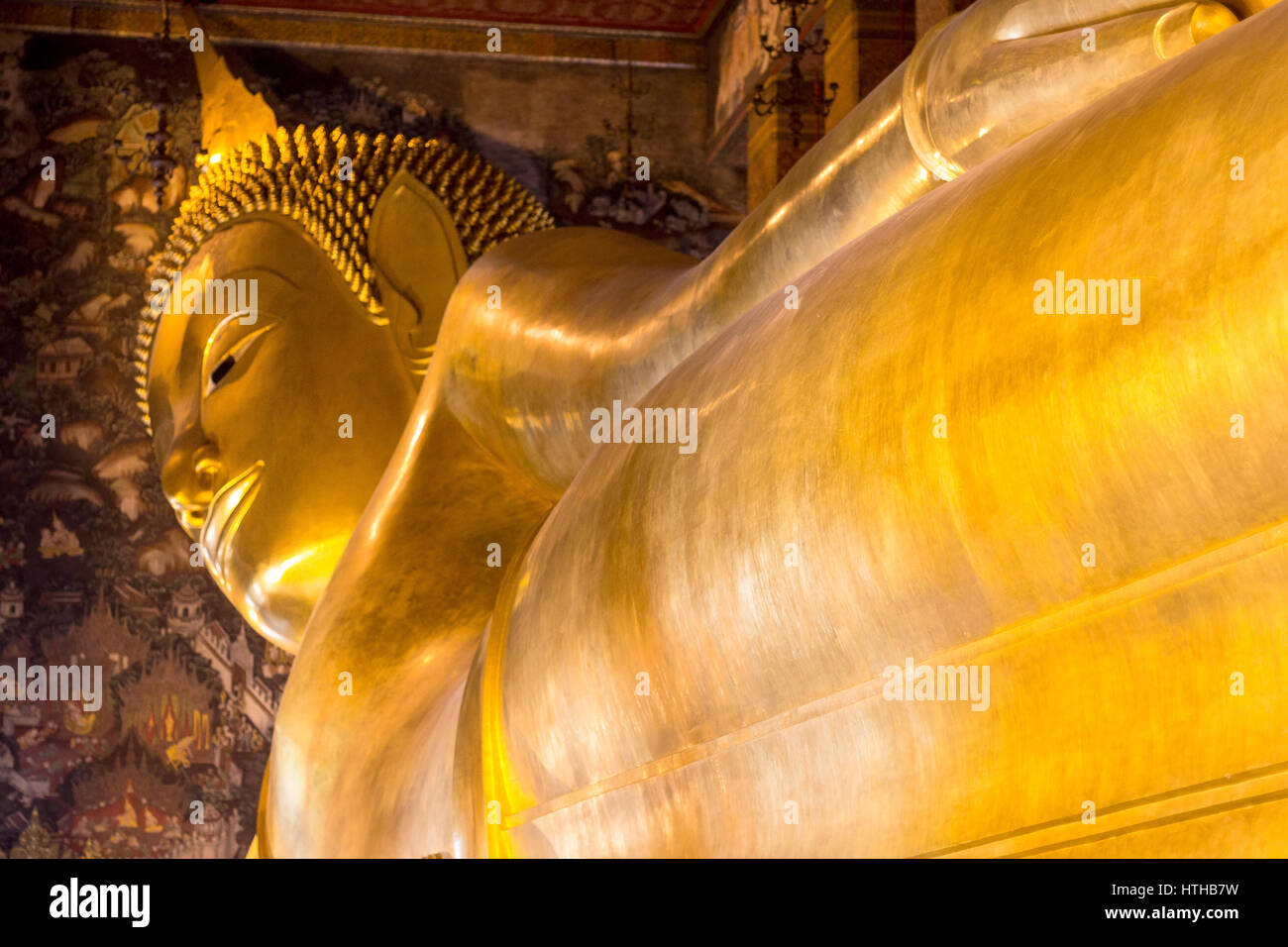 Reclining Buddha sculpture at the Temple of The Reclining Buddha (Wat Pho) in Bangkok, Thailand ...