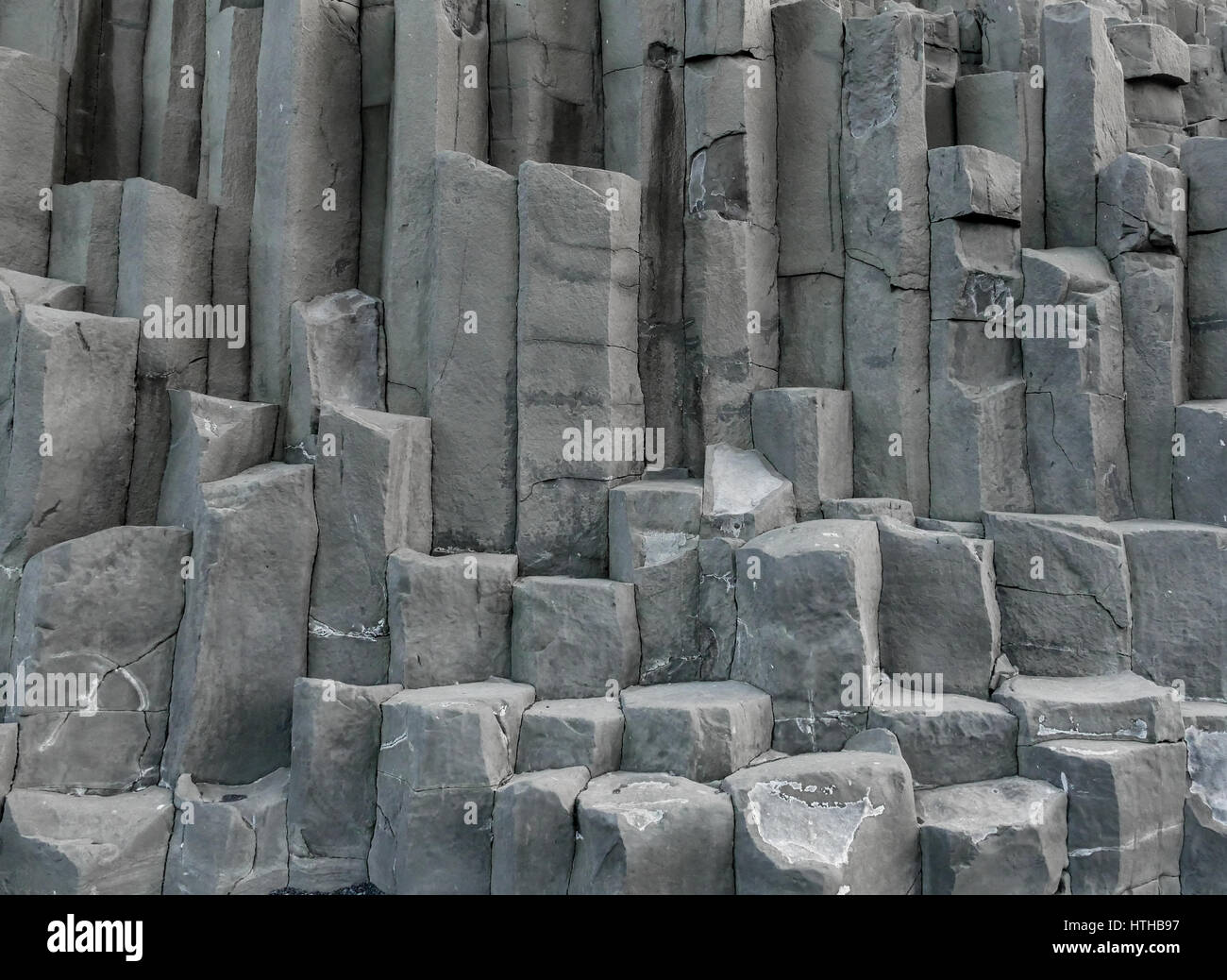 Stacks of grey volcanic hexagonal basalt volcanic rock columns ...