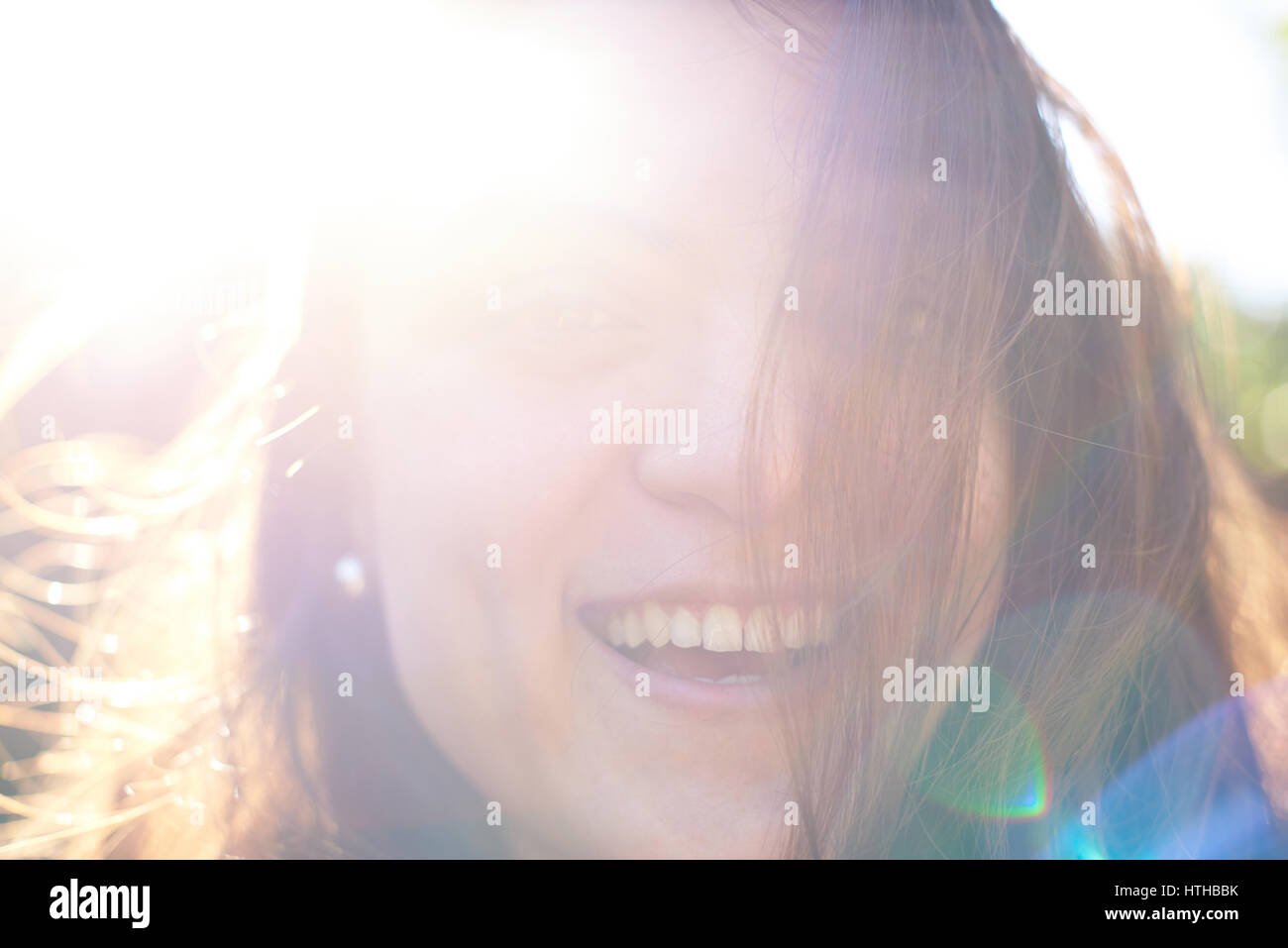 Female face smile sun light hi-res stock photography and images - Alamy