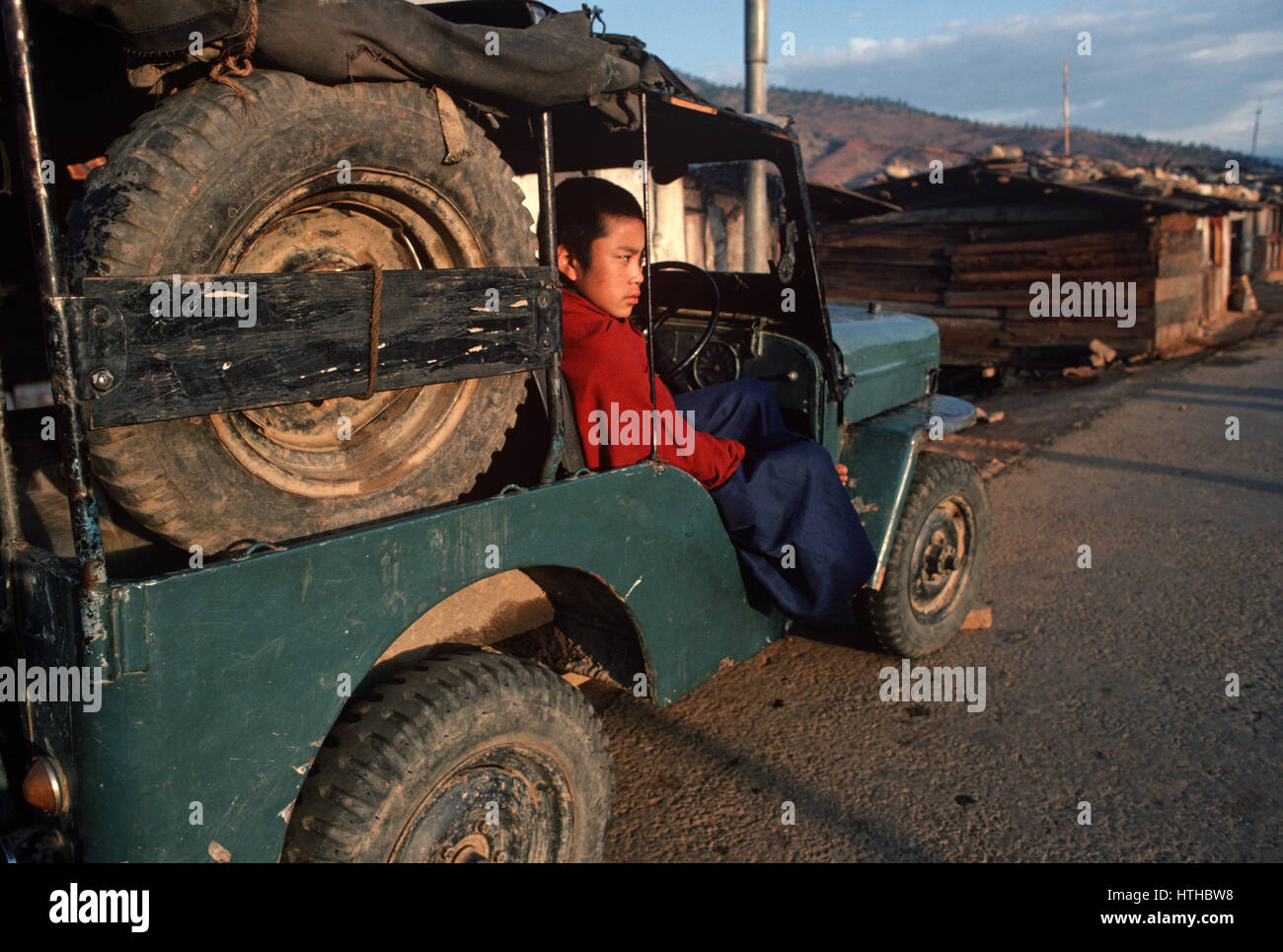 Buddhist monk sitting in Jeep, Wangdiphodrang village, Bhutan ...