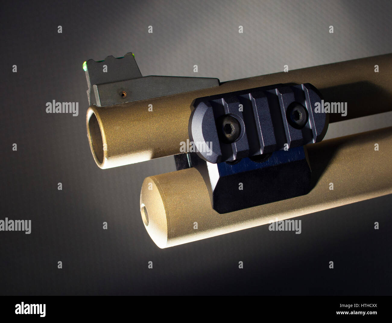Rail attached to a shotgun designed to mount a flashlight Stock Photo ...