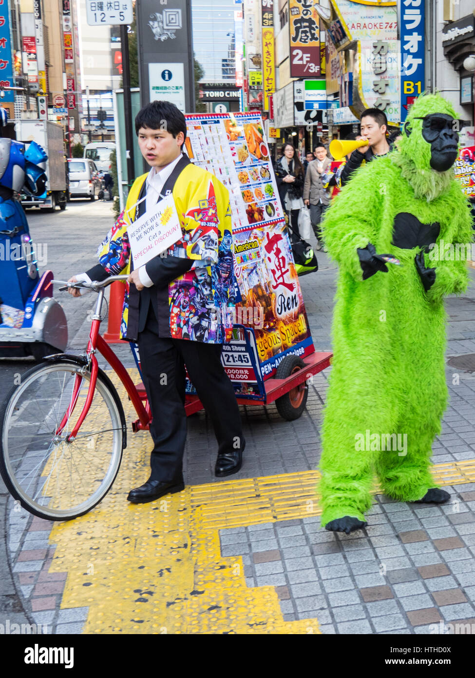 Actors dressed up in mascot suits touting for business for a Robot ...
