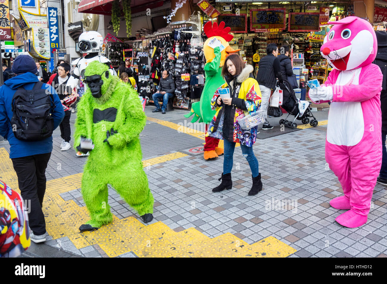 Actors dressed up in mascot suits touting for business for a Robot ...