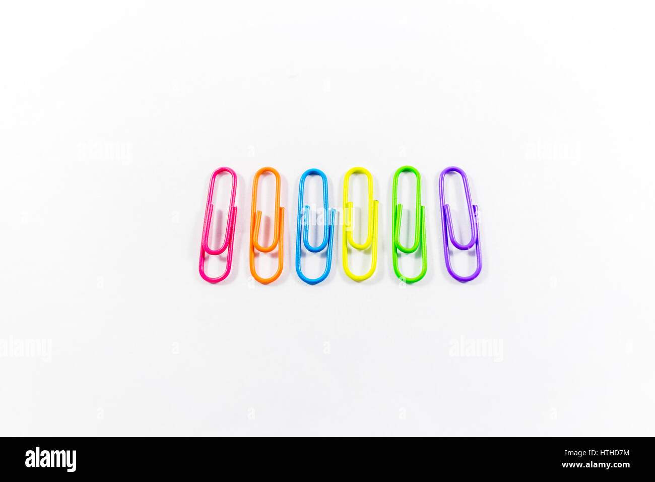 Office paper clips isolated on white background Stock Photo - Alamy