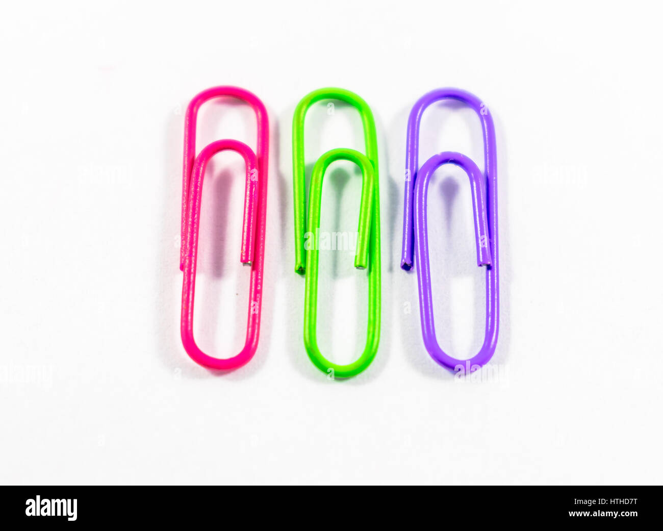 Office paper clips isolated on white background Stock Photo - Alamy