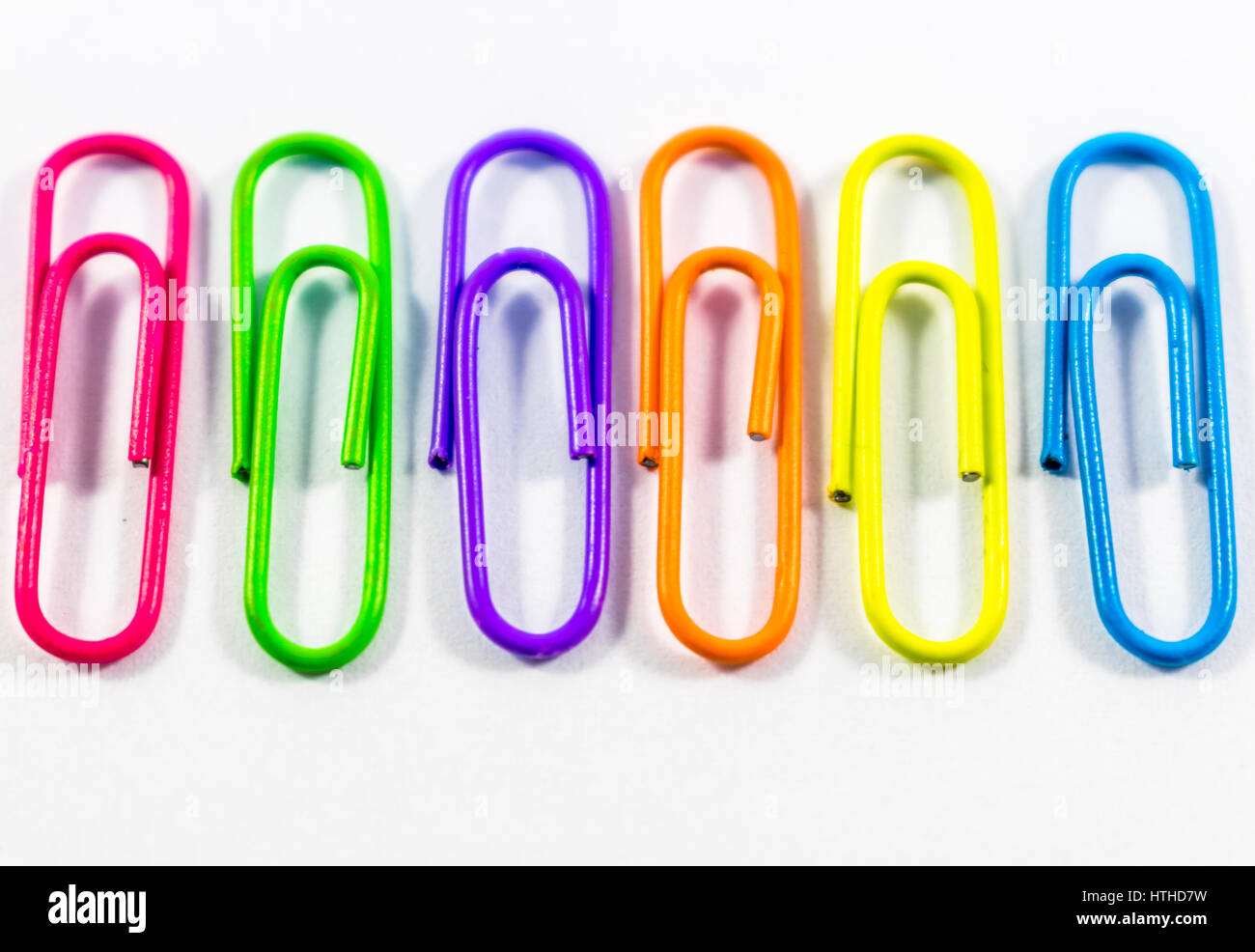 Office paper clips isolated on white background Stock Photo - Alamy