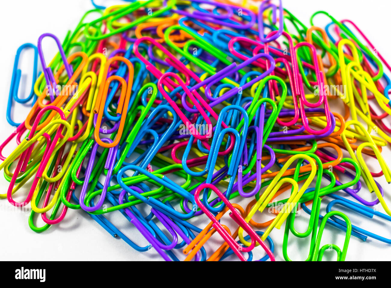 Office paper clips isolated on white background Stock Photo - Alamy