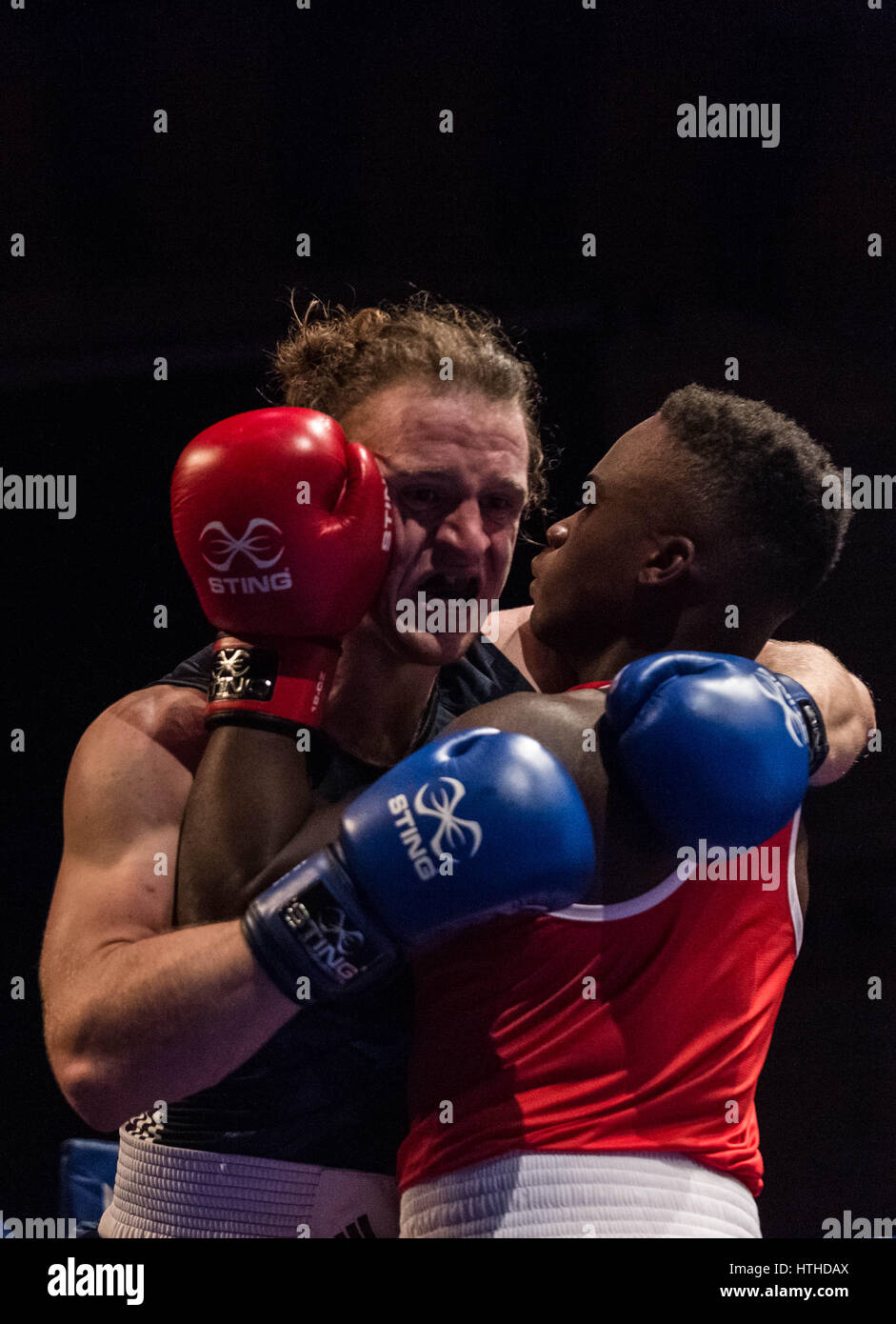 Cambridge, UK. 10th March, 2017. Judah Aiyenuro (Red, Cambs) v Enzo ...