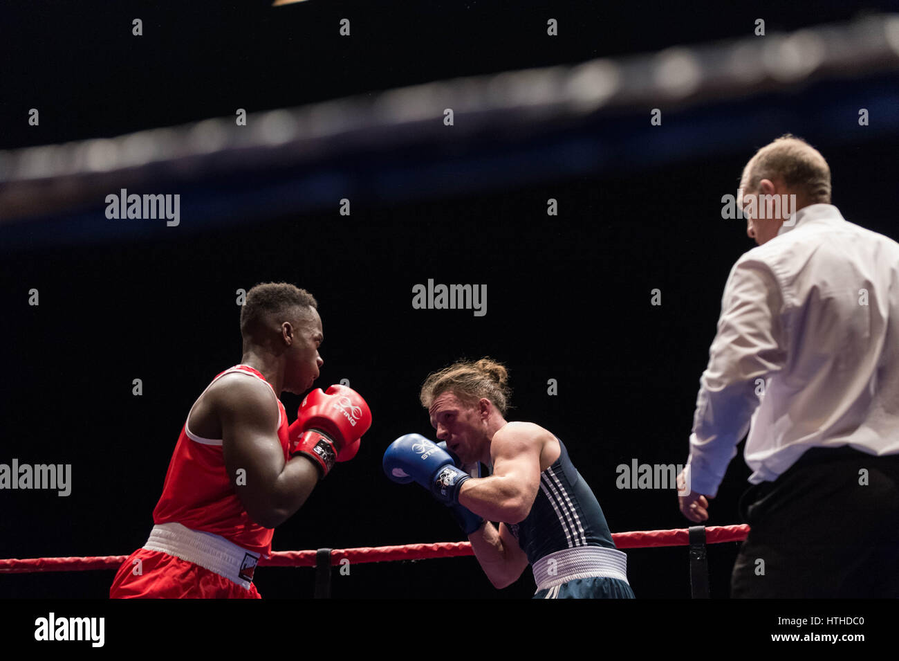 Cambridge, UK. 10th March, 2017. Judah Aiyenuro (Red, Cambs) v Enzo ...