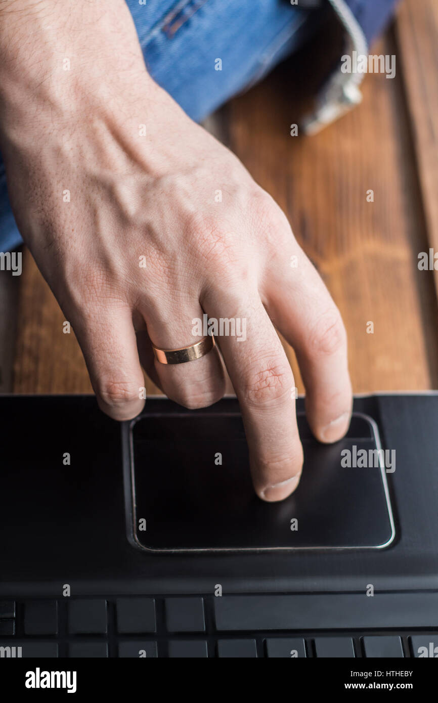 Finger on trackpad of computer hi-res stock photography and images - Alamy