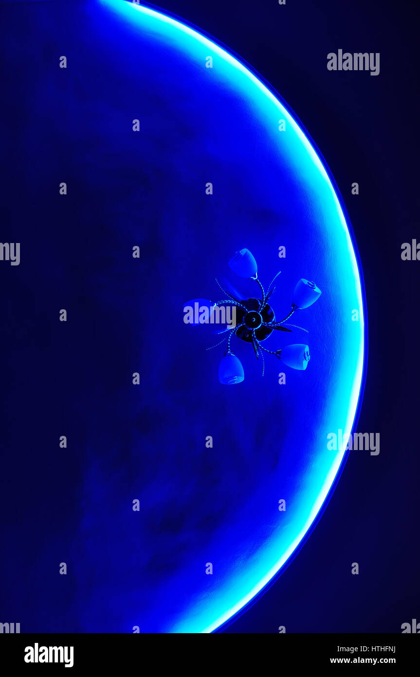 Abstract blue space. Arc blue backlight on the ceiling Stock Photo - Alamy