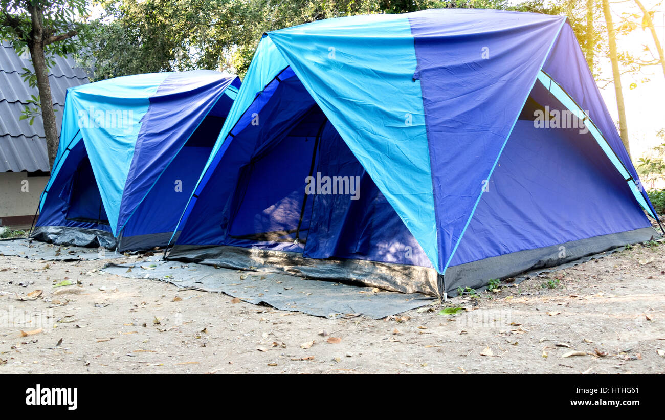 blue tent camping in forest, outdoor travel concept Stock Photo - Alamy