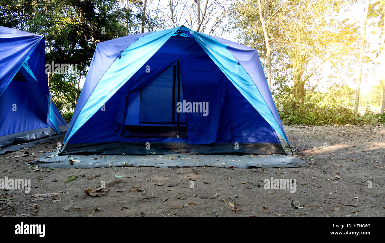 blue tent camping in forest, outdoor travel concept Stock Photo - Alamy