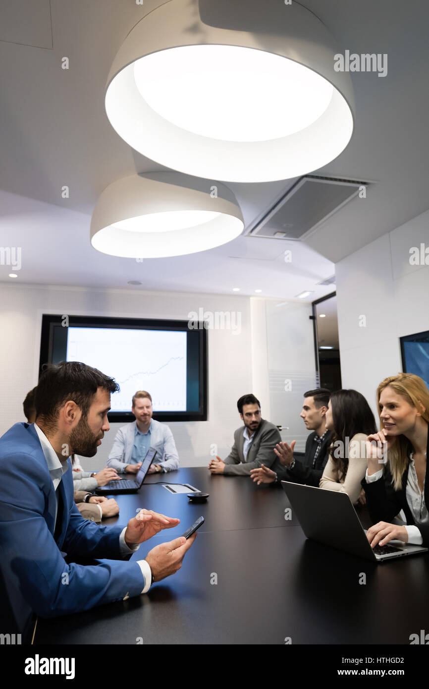 Business meeting and presentation in modern conference room for ...