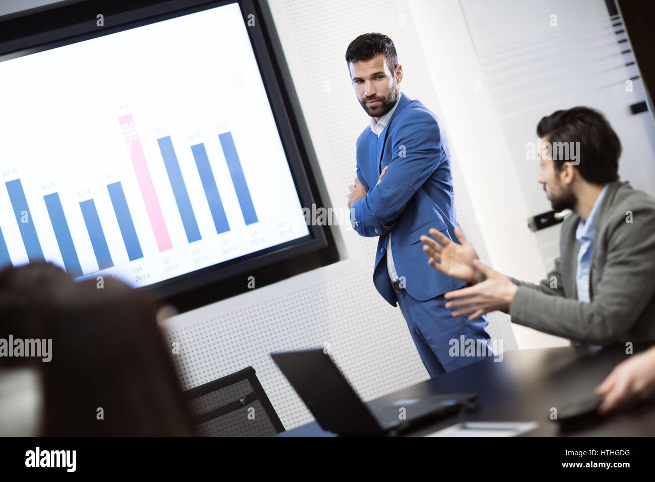 Business people analyzing data at meeting in office and doing ...